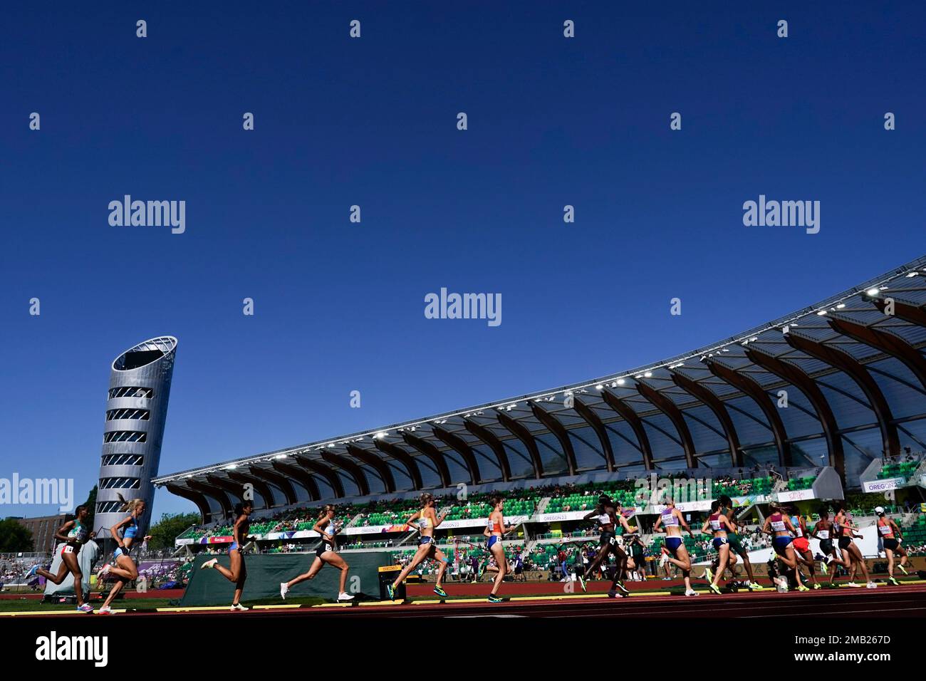 Women competes during a heat in the women's 5000-meter run at the World ...