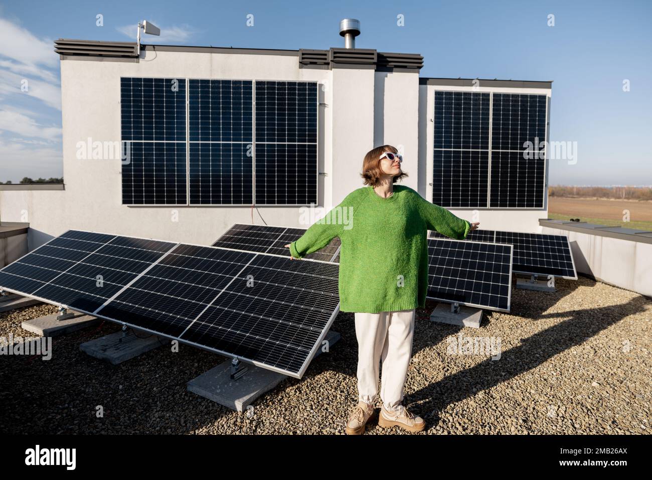 Happy house owner with a solar plant Stock Photo - Alamy
