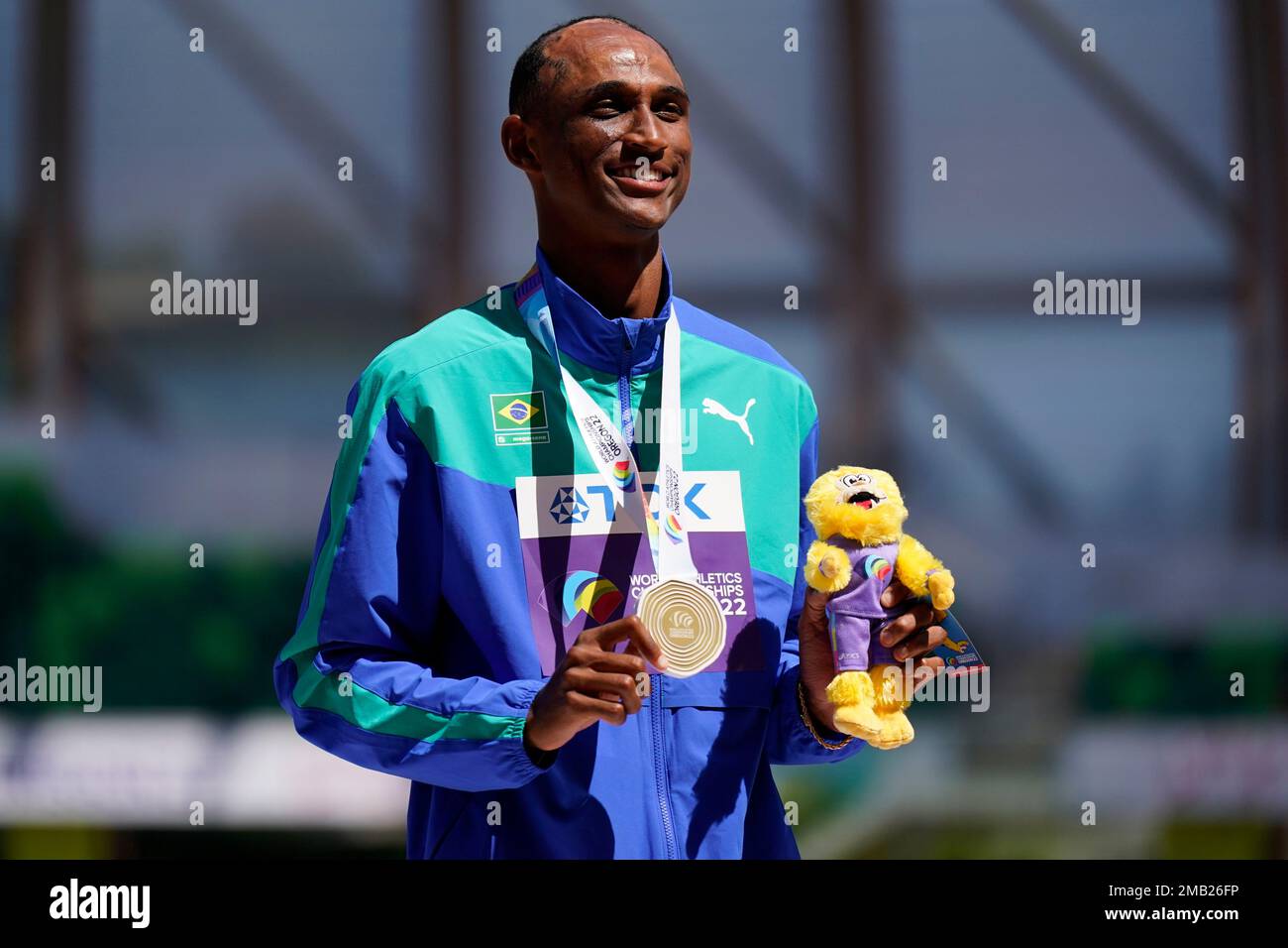 Gold medalist Alison Dos Santos, of Brazil, poses for a photo during a ...