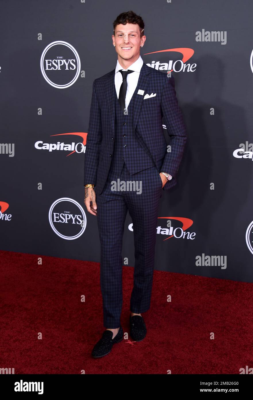 Track and field player Nick Mayhugh arrives at the ESPY Awards on ...