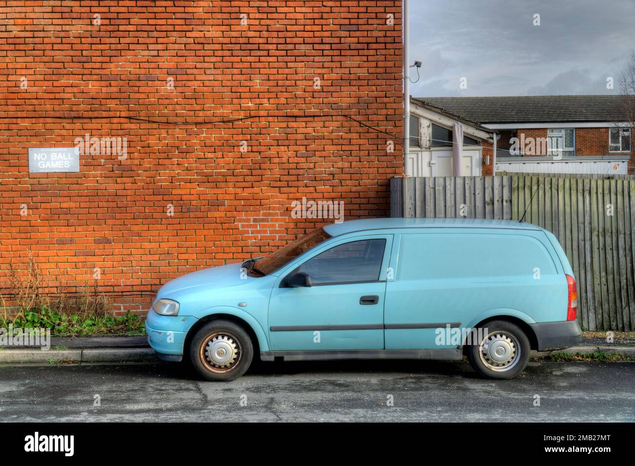 blue astra van parked on street red brick wall wooden fence southampton ...