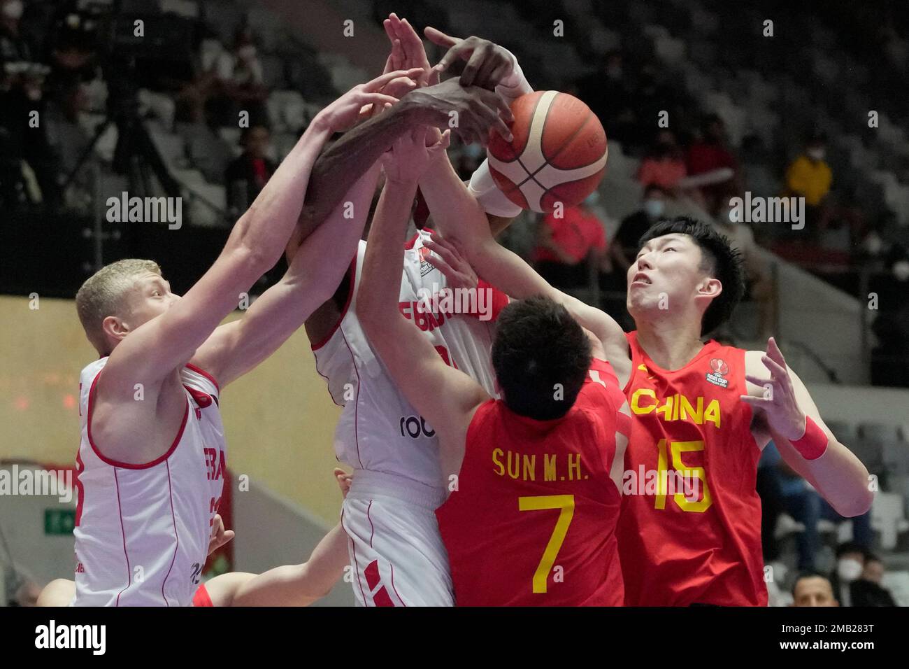 China's Zhou Qi, right, and Sun Minghui, second right, battle for a ...