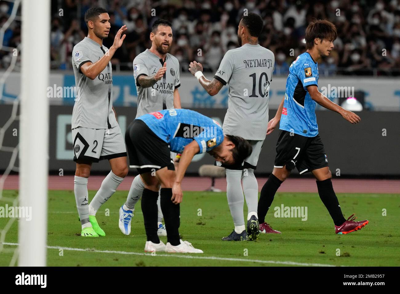 Paris Saint-Germain's Lionel Messi is congratulated by teammates Achraf ...