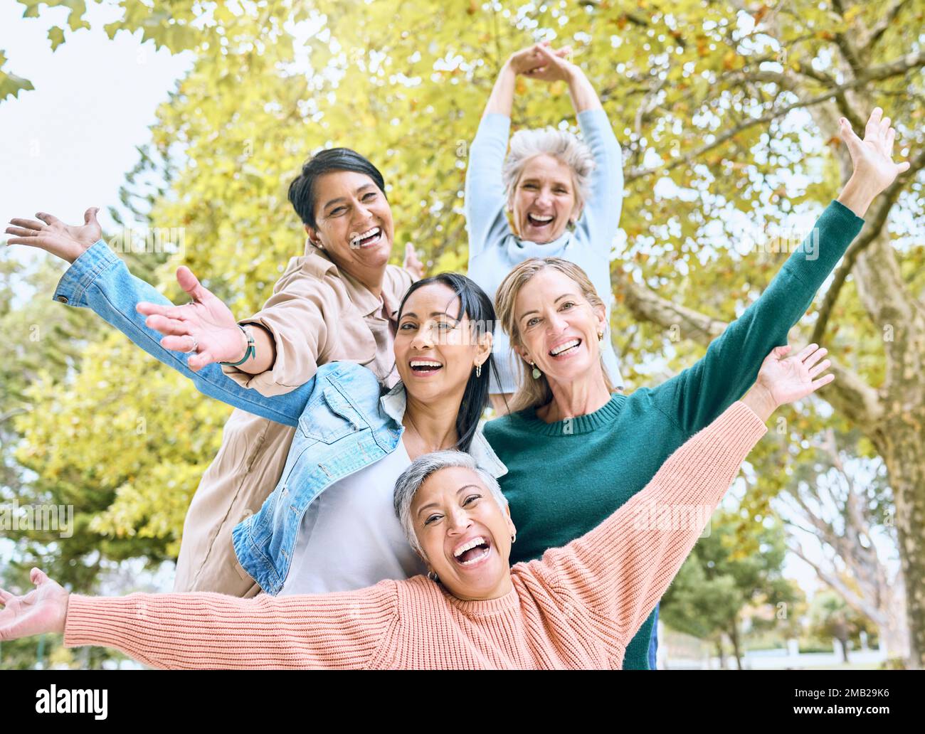 Senior retirement, portrait and hands up in fun game, goofy activity or ...