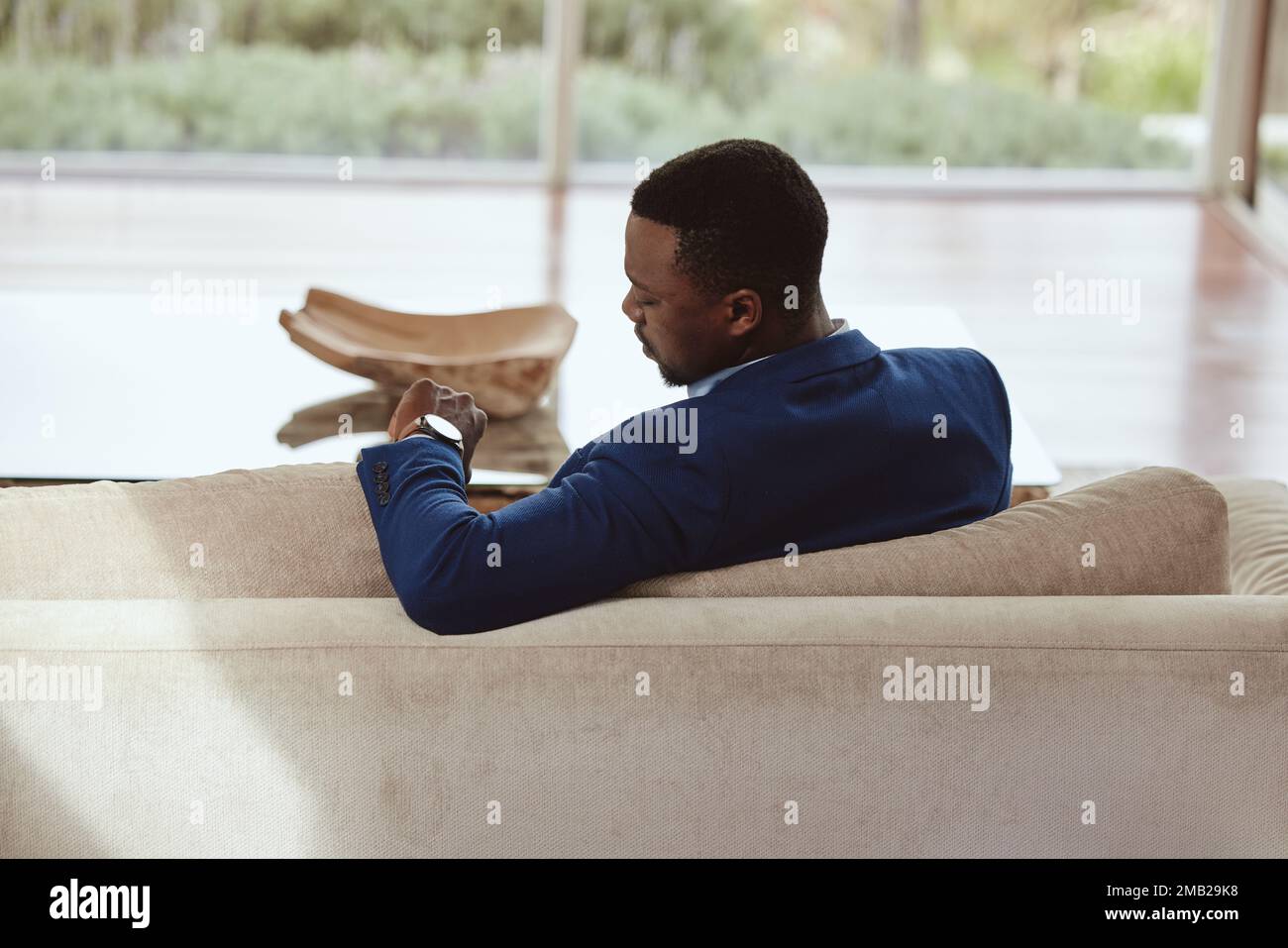 Waiting man looking watch showing hi-res stock photography and images ...
