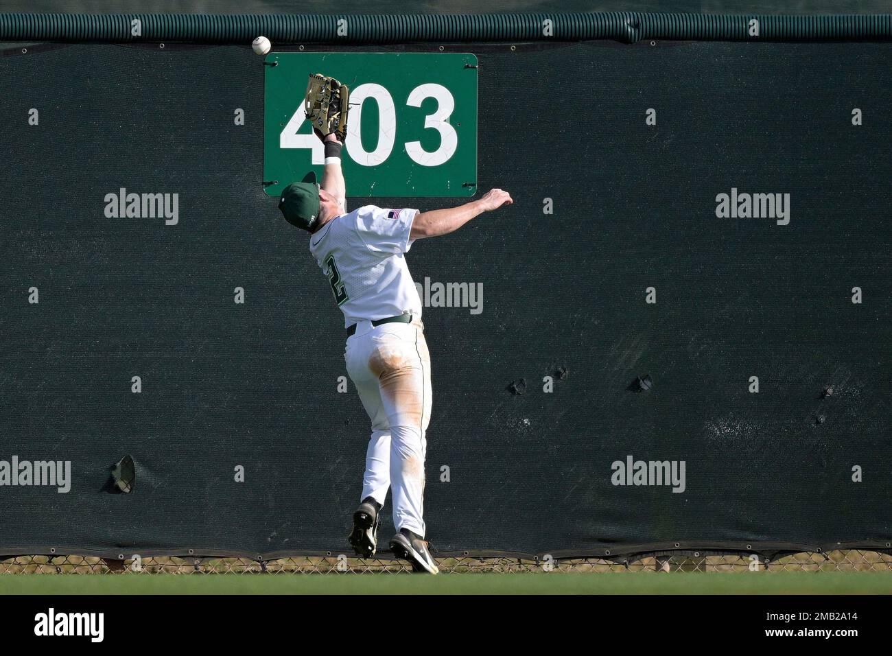 Stetson outfielder Cameron Hill (2) misses a fly ball hit to the wall ...