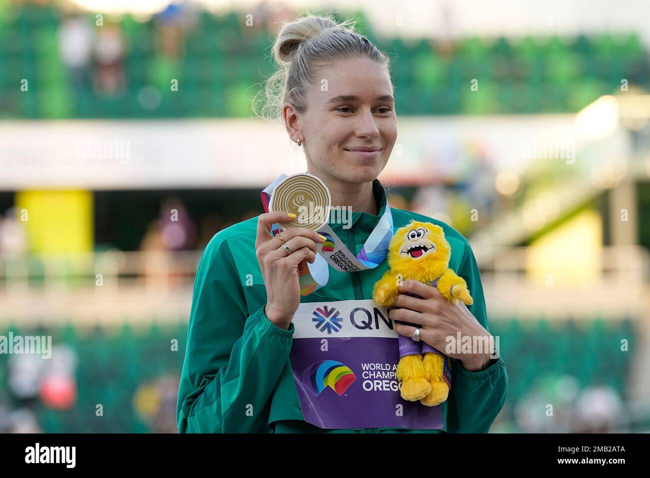 Gold medalist Eleanor Patterson, of Australia, poses on the podium ...