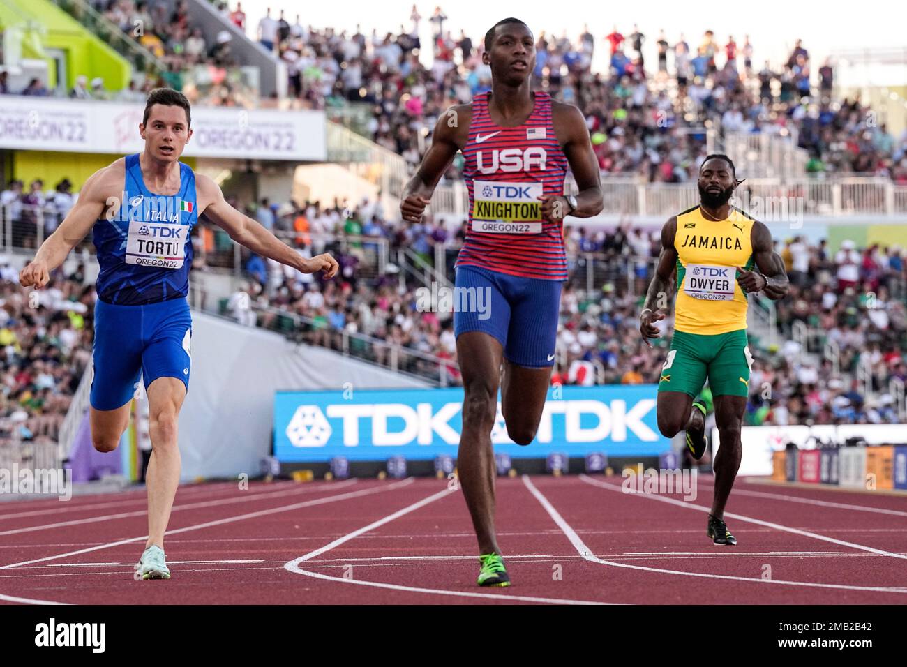 Erriyon Knighton, of the United States, wins a heat during the men's ...