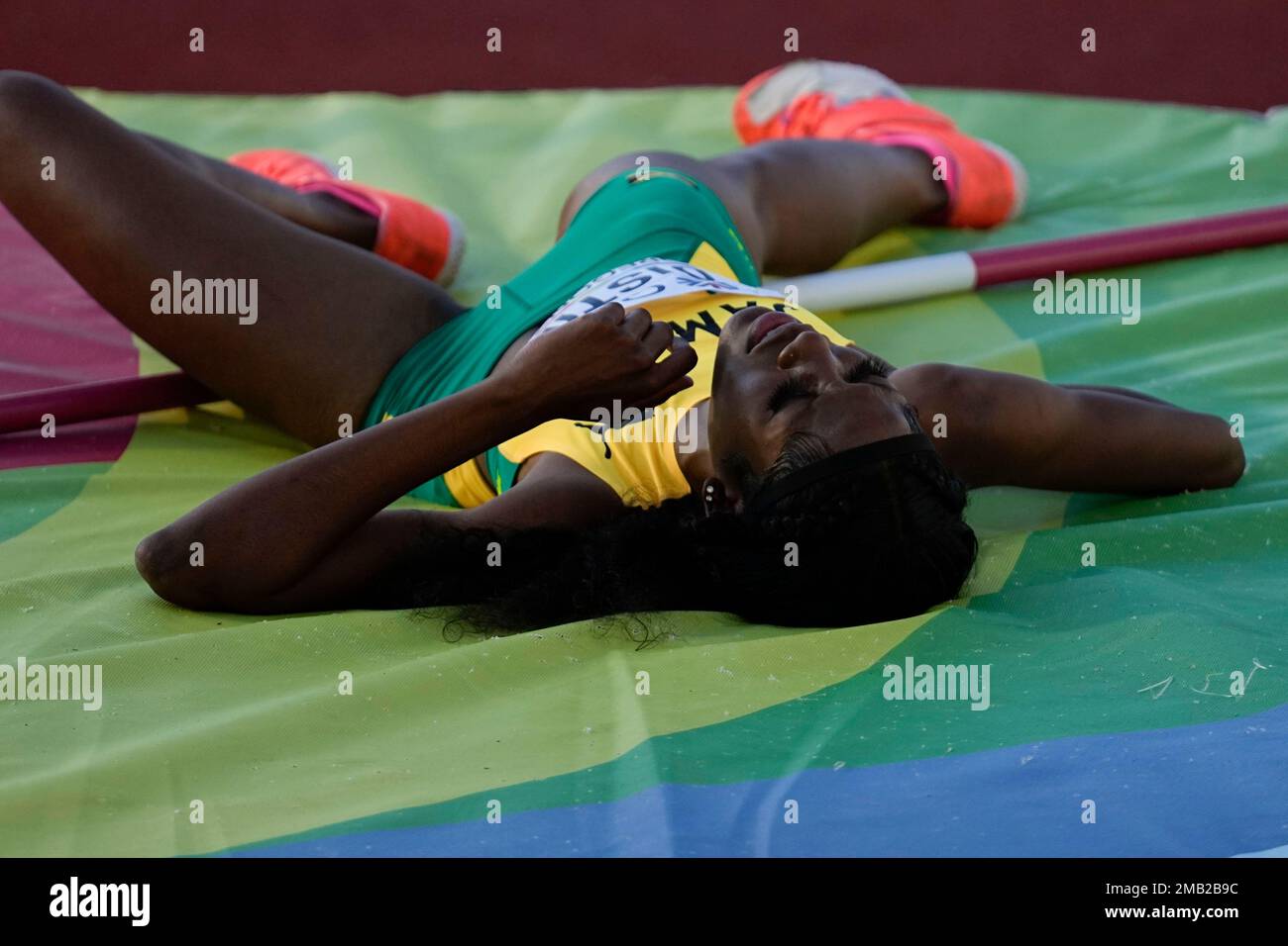 Lamara Distin, of Jamaica, reacts after not clearing the bar during the ...