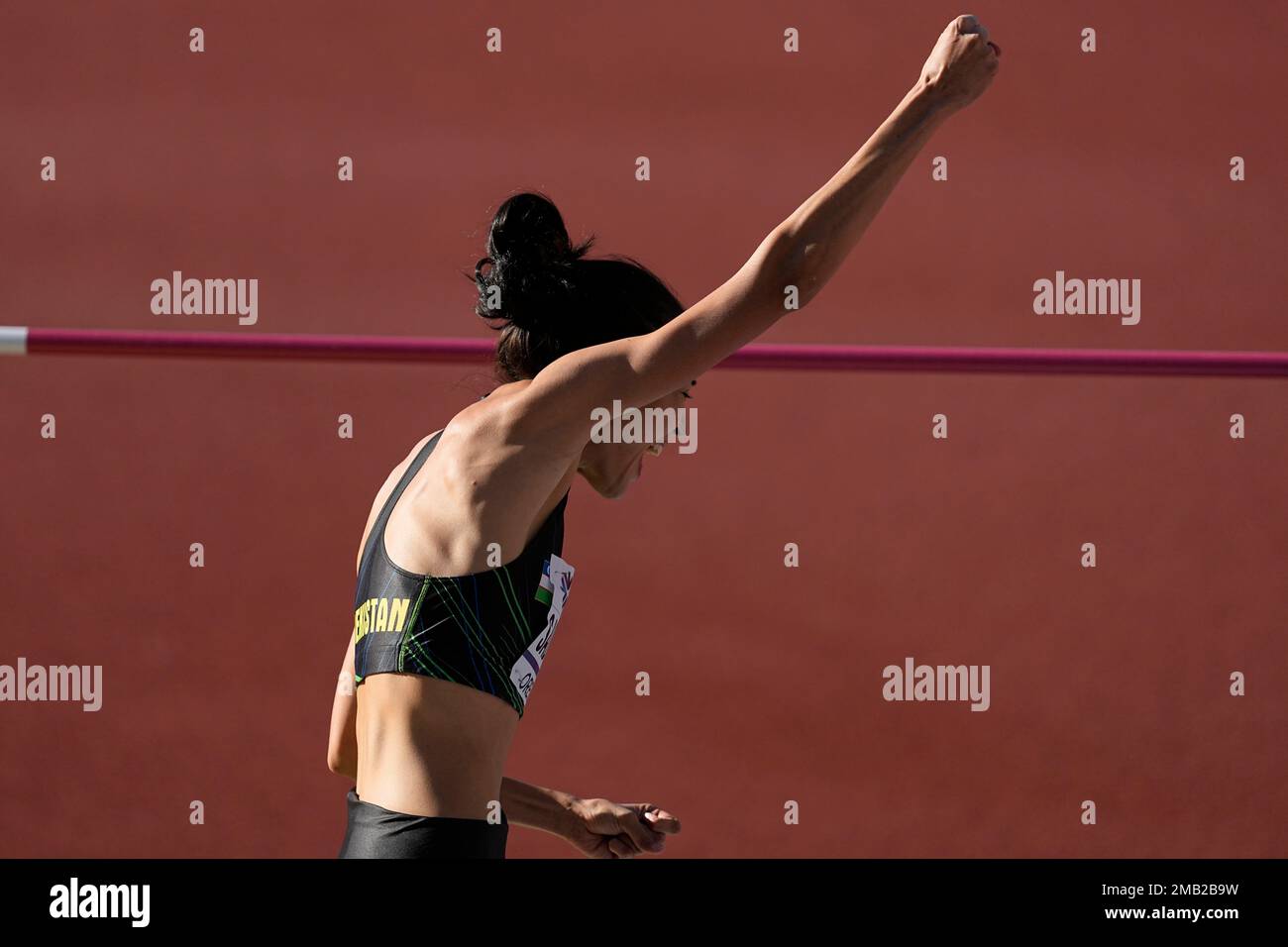 Safina Sadullayeva, of Uzbekistan, reacts after her jump during the ...