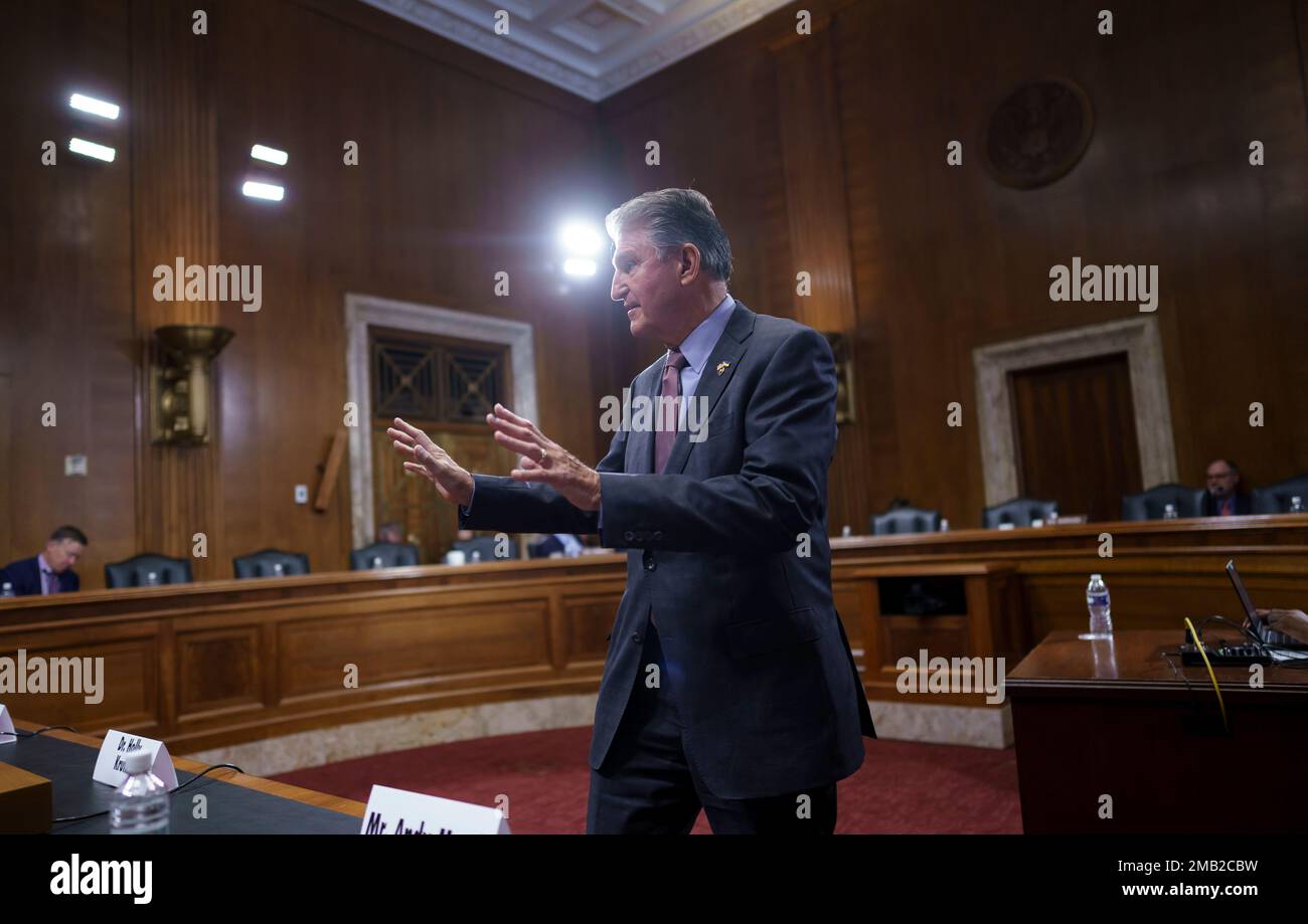Sen. Joe Manchin, D-W.Va., arrives to greet witnesses as he chairs the ...