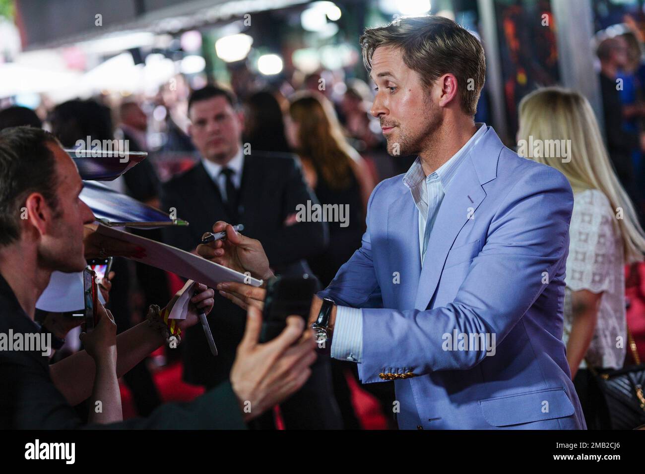 Ryan Gosling signs autographs upon arrival at the screening of the film ...