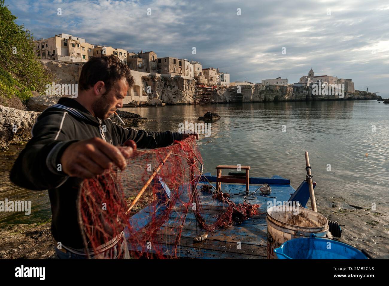 Fisherman fishes in sea hi-res stock photography and images - Alamy