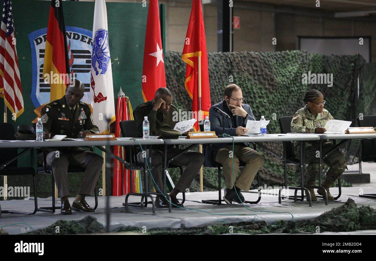 U.S. Army Command Sgt. Maj. Kofie B. Primus (left) of the 21st Theater Sustainment Command, Maj ...