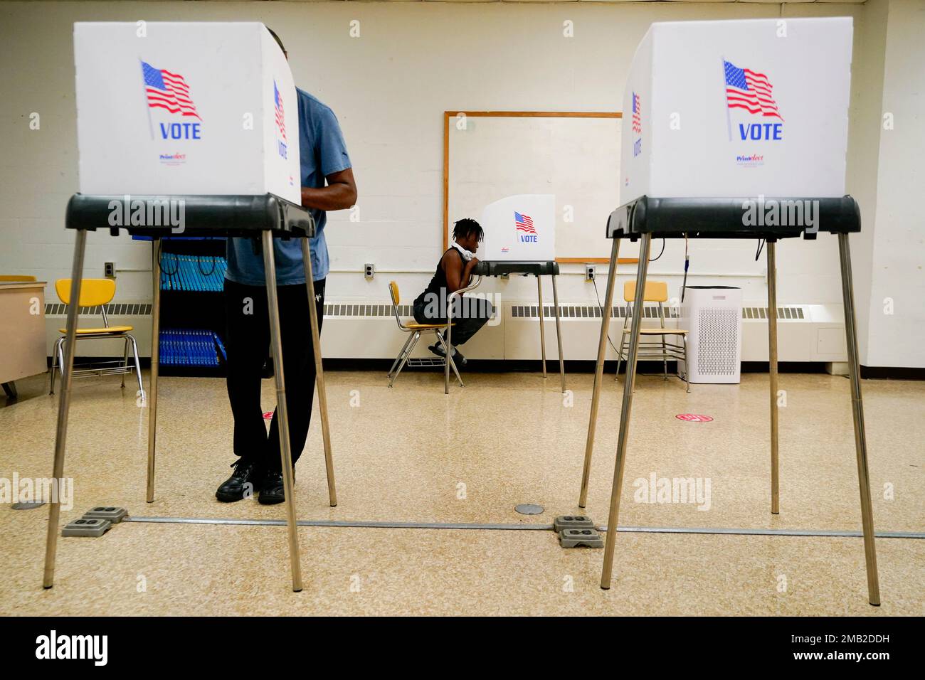 People cast votes at Edmondson Westside High School during Maryland's ...