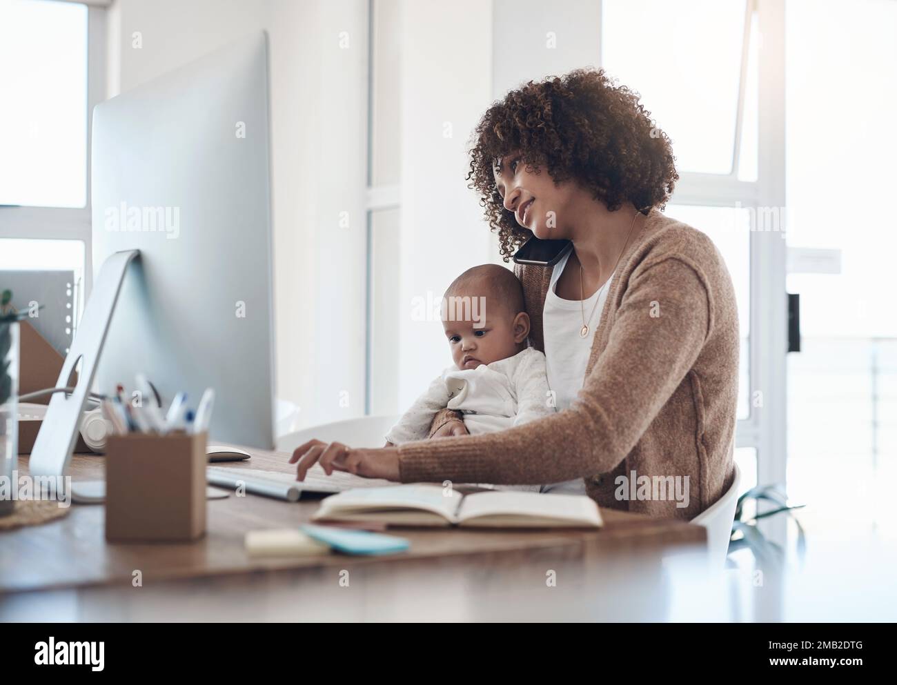 Lockdown took a little adjustment. a young woman using a smartphone and ...