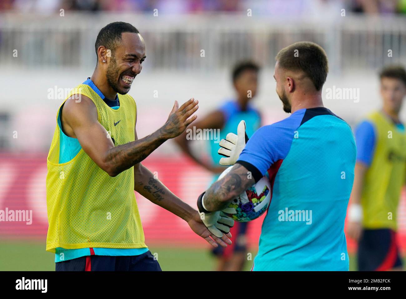 FC Barcelona's Pierre-Emerick Aubameyang, left, and Arnau Tenas greet ...