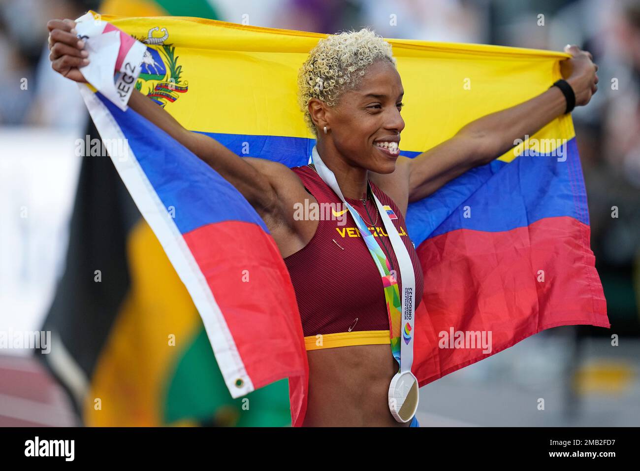 Gold medalist Yulimar Rojas, of Venezuela, celebrates her win in the ...