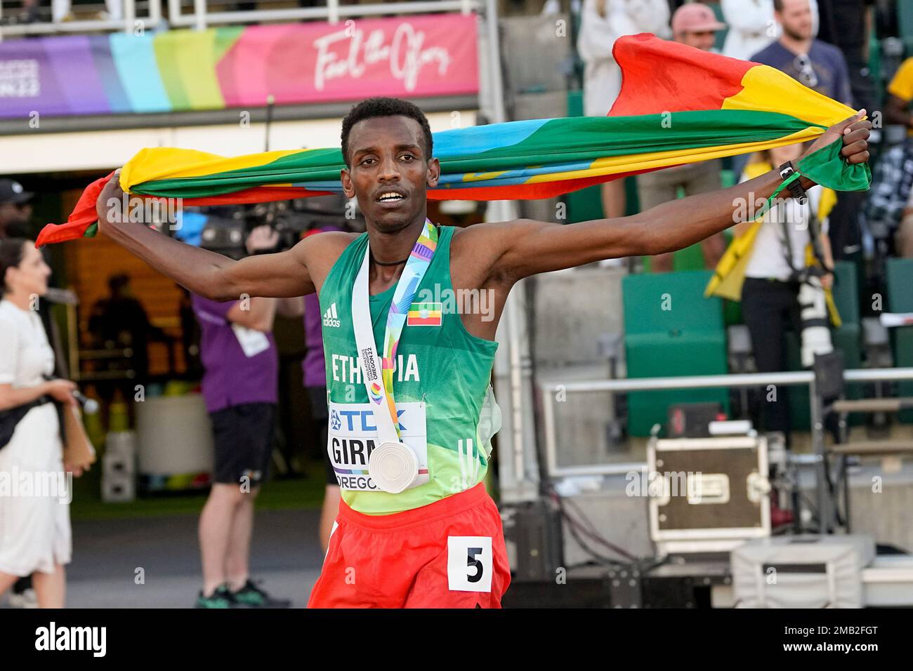 Silver medalist Lamecha Girma, of Ethiopia, celebrates after the men's ...