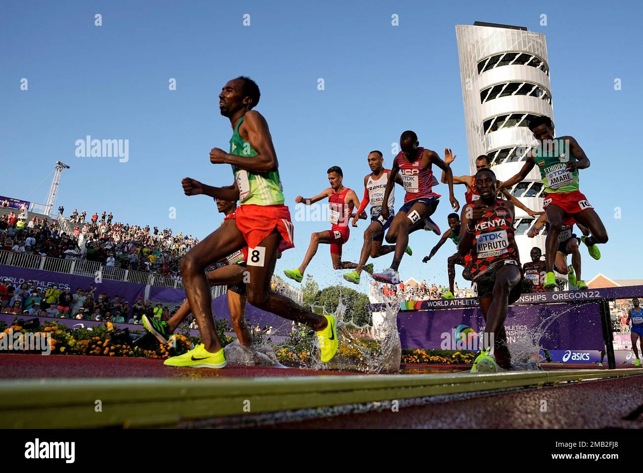Runners compete during the men's 3000-meter steeplechase final at the ...
