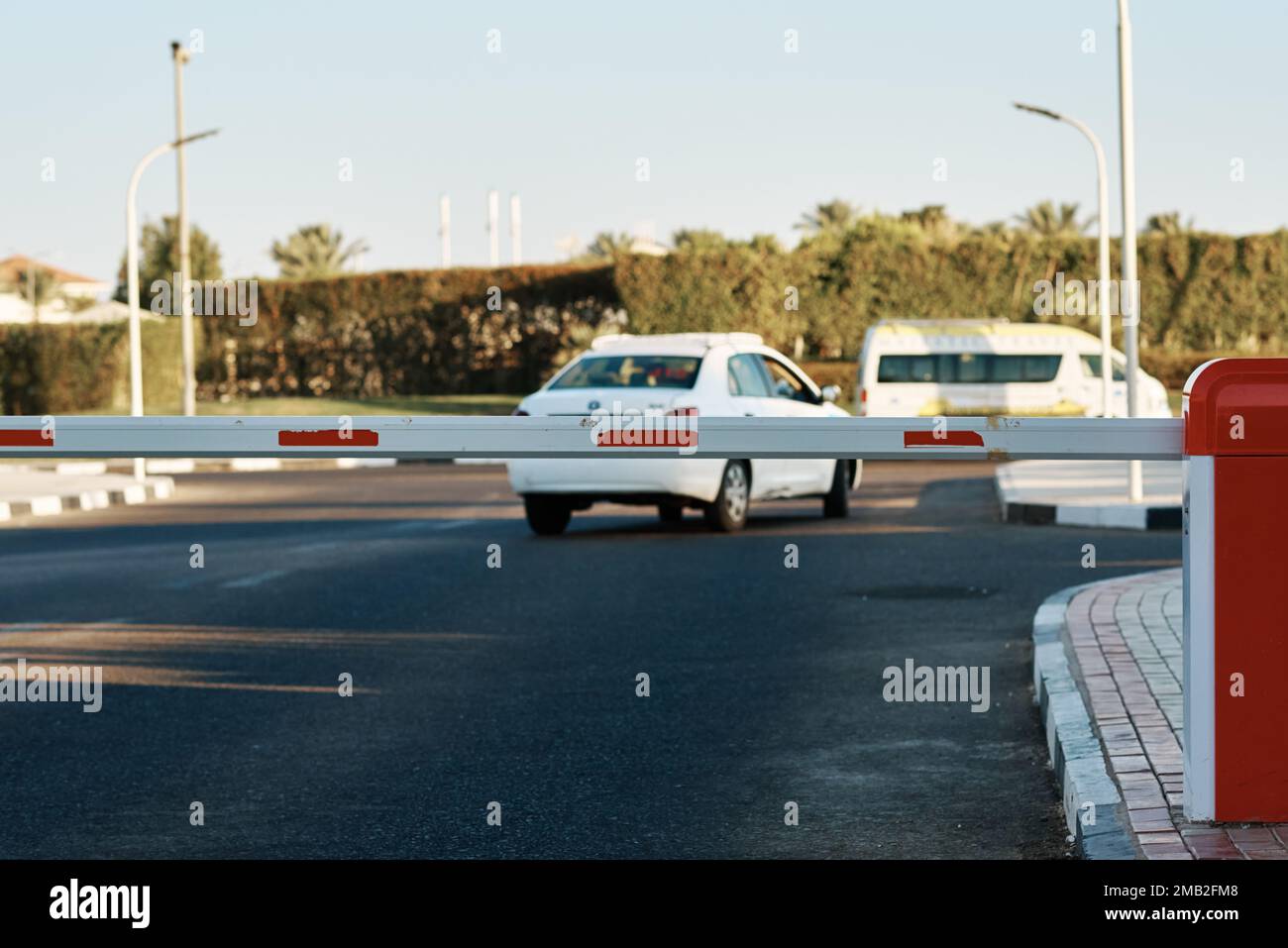 Checkpoint with security and automatic barrier on street. Guarded ...