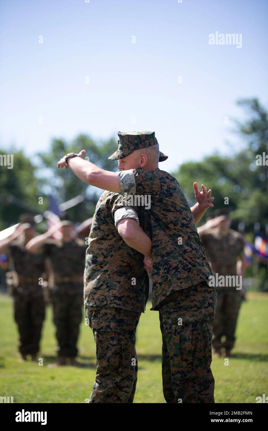 U.S. Marine Corps Lt. Col. Erik C. Quist, right, outgoing commanding officer, passes the ...