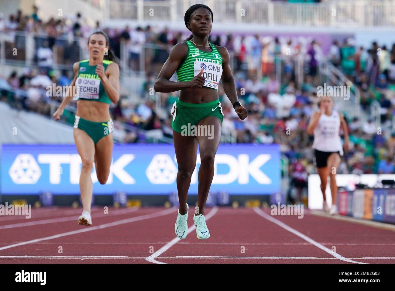 Favour Ofili, of Nigeria, wins a heat in the women's 200-meter run a ...