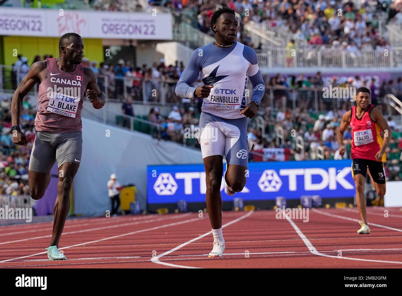 Joseph Fahnbulleh, of Liberia, wins a heat in the men's 200-meter run ...