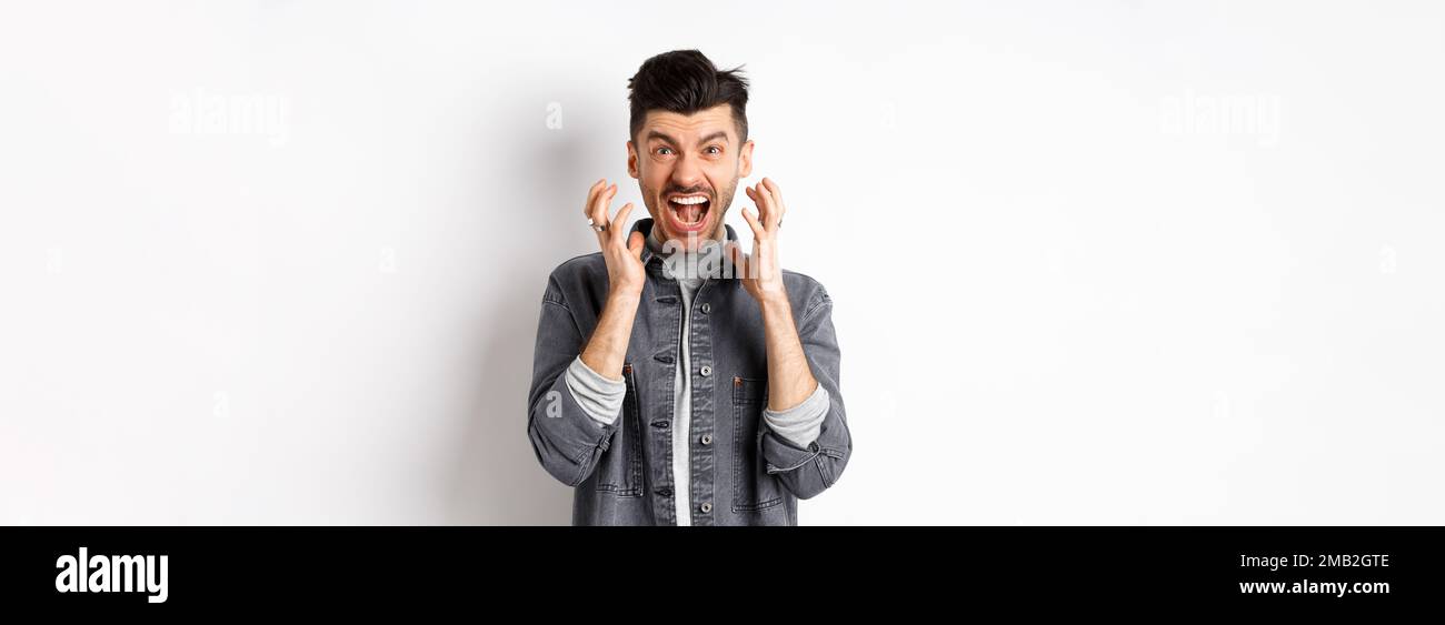 Angry man screaming distressed, losing temper and shouting frustrated ...