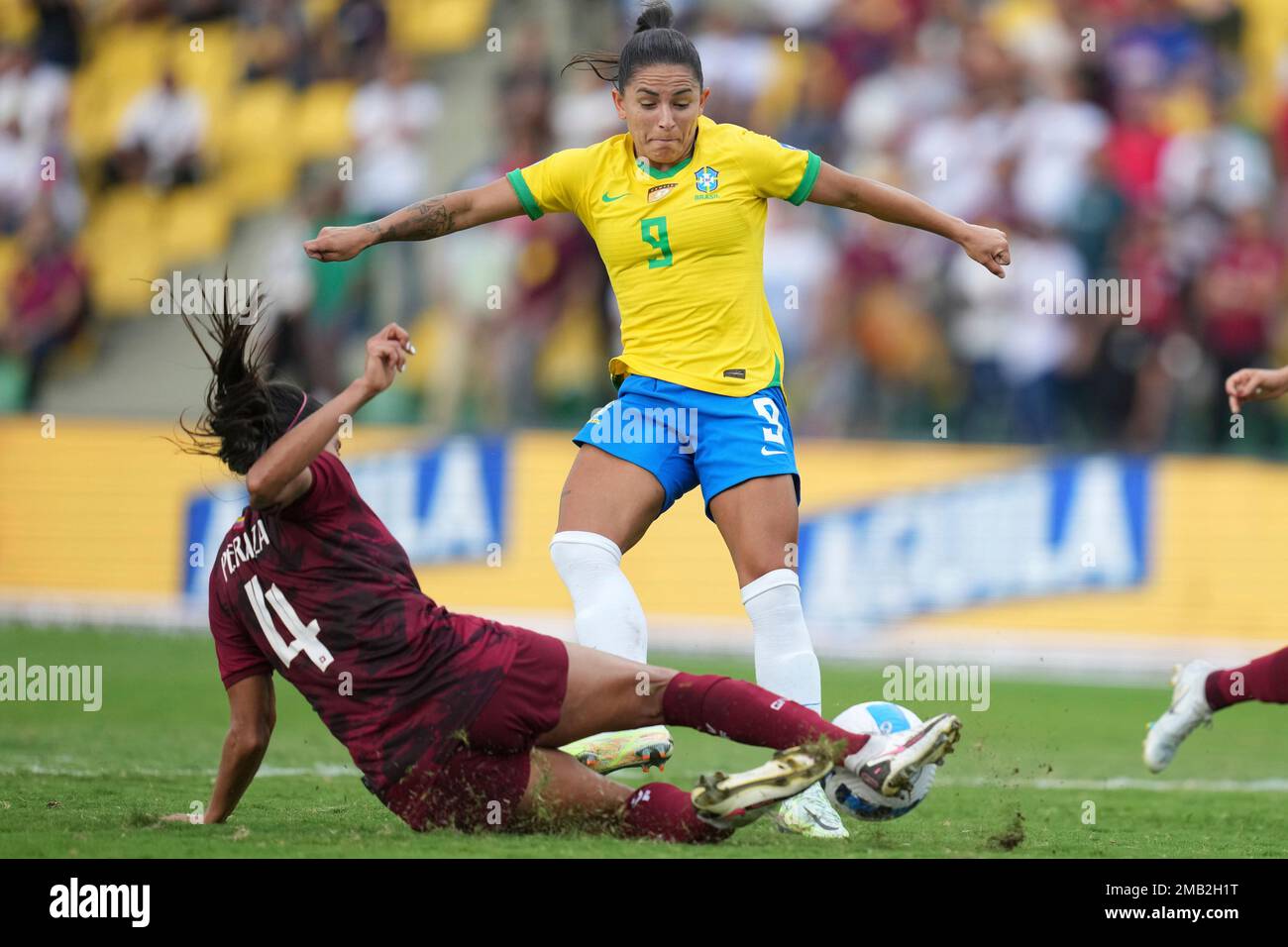 Brazil's Rafaelle, 9, and Venezuela's Maria Peraza fight for the ball ...