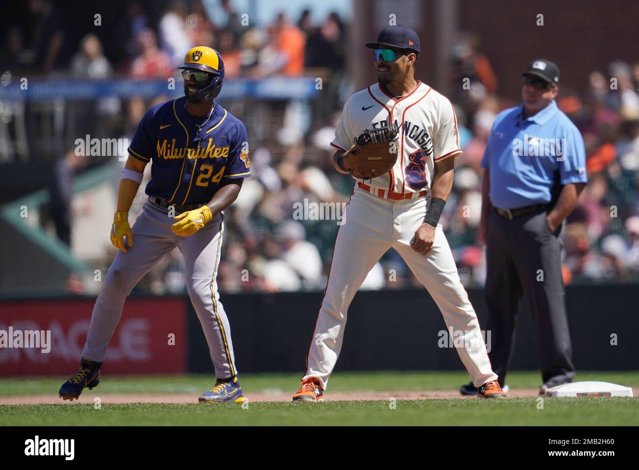 Milwaukee Brewers' Andrew McCutchen, left, and San Francisco Giants ...