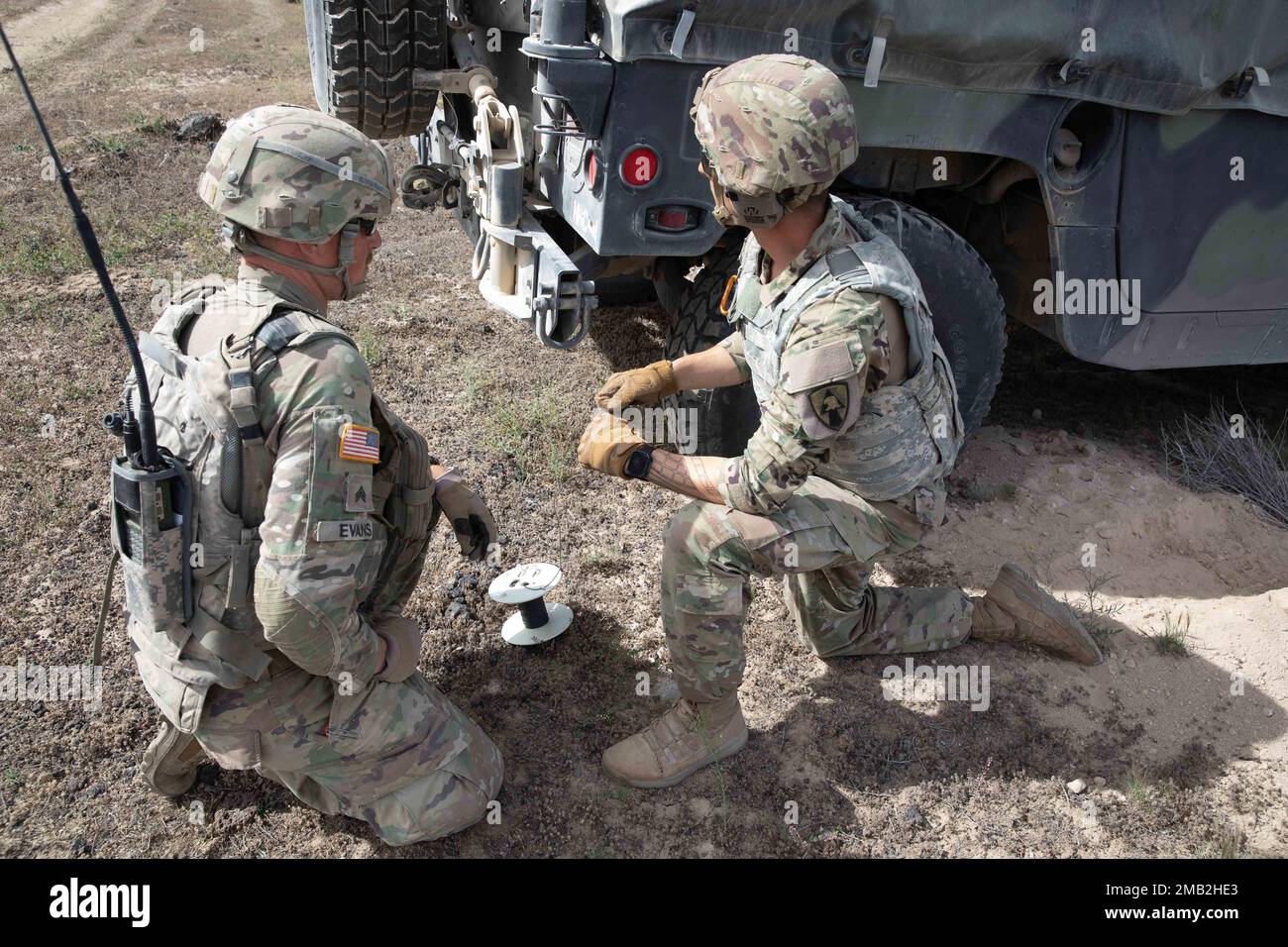 Sgt. Dylon Evans directs Pfc. Aaron Bartholomew, both combat engineers ...