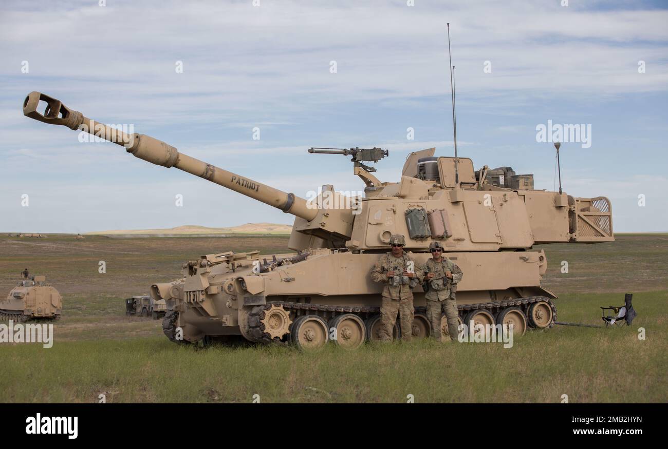 1st Lt. John Christiansen and Staff Sgt. Jerney Topham, artillery Soldiers with Bravo Battery ...