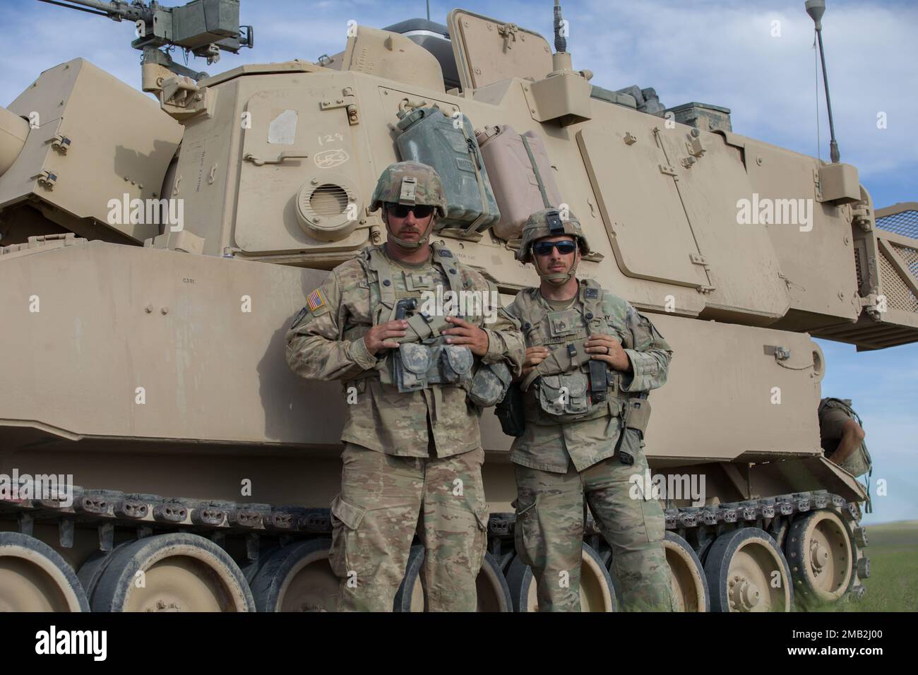 1st Lt. John Christiansen and Staff Sgt. Jerney Topham, artillery soldiers with Bravo Battery ...