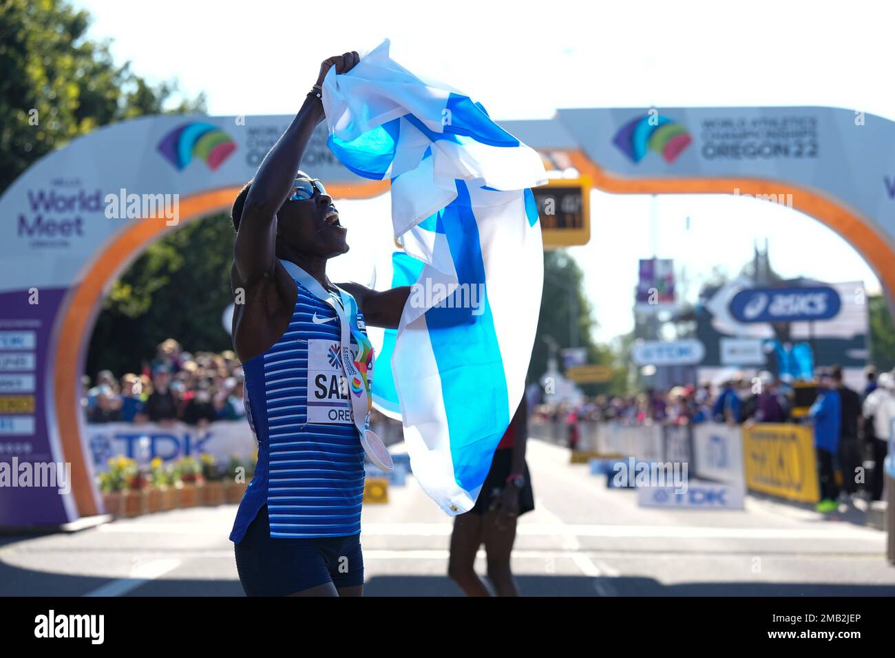 Lonah Chemtai Salpeter, of Israel, celebrates her third place finish in ...