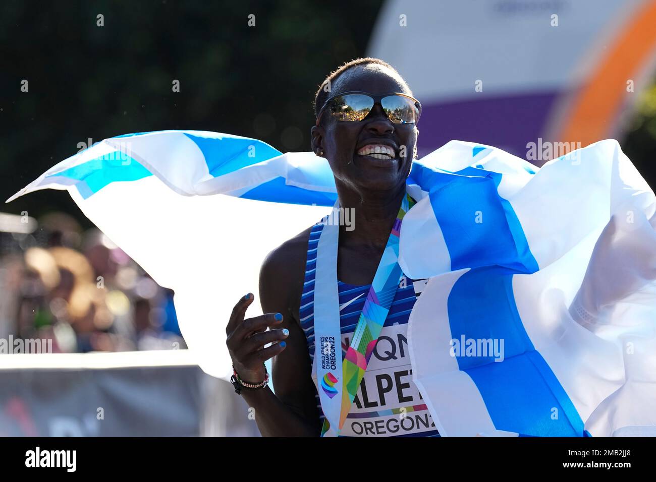 Lonah Chemtai Salpeter, of Israel, celebrates her third place finish in ...