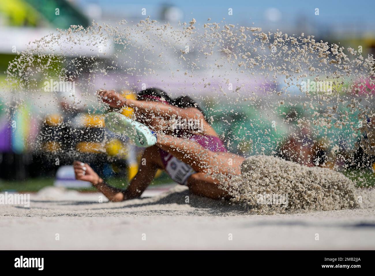 Kendell Williams, of the United States, competes in the long jump ...