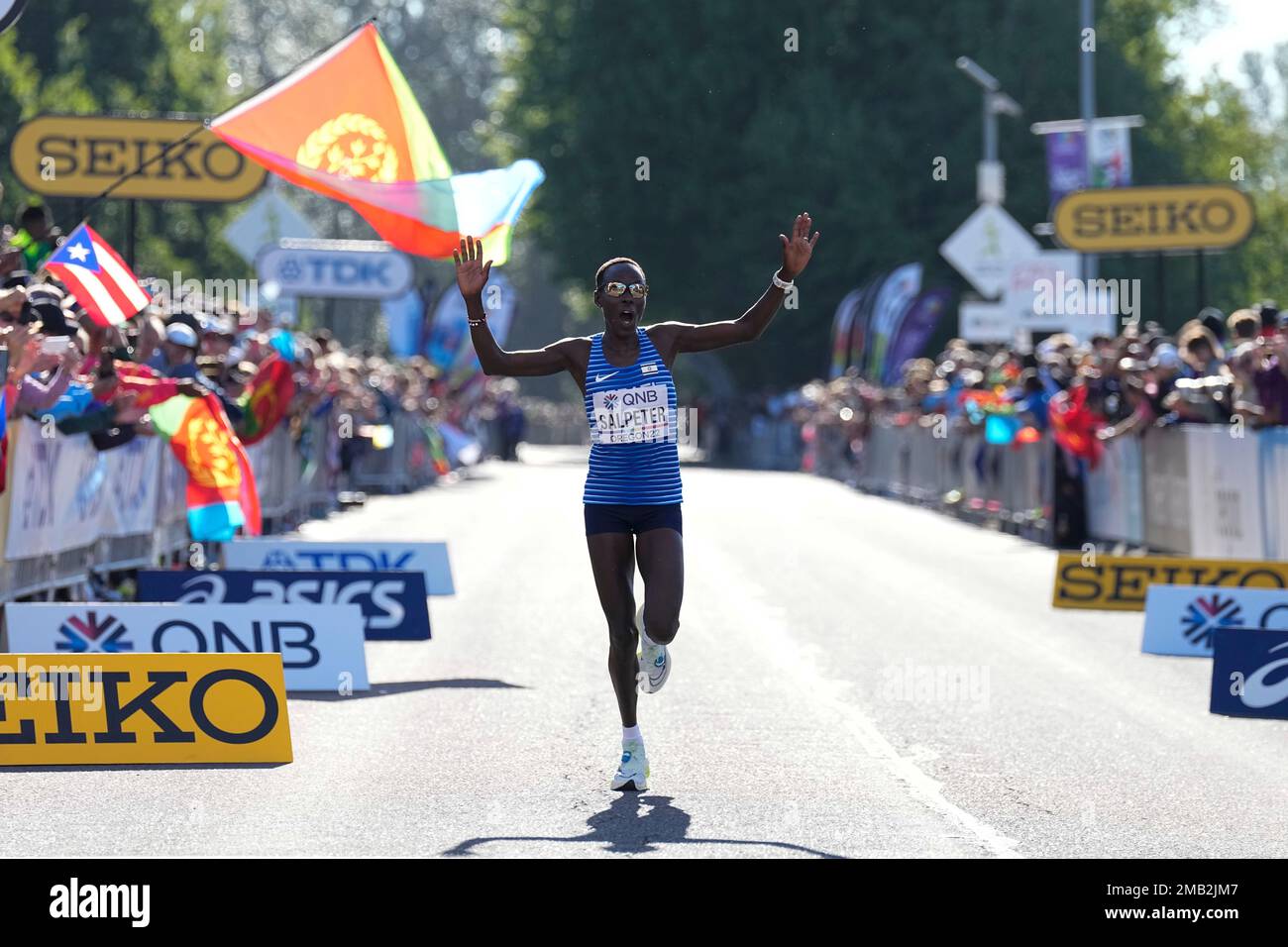 Lonah Chemtai Salpeter, of Israel, celebrates her third place finish in ...