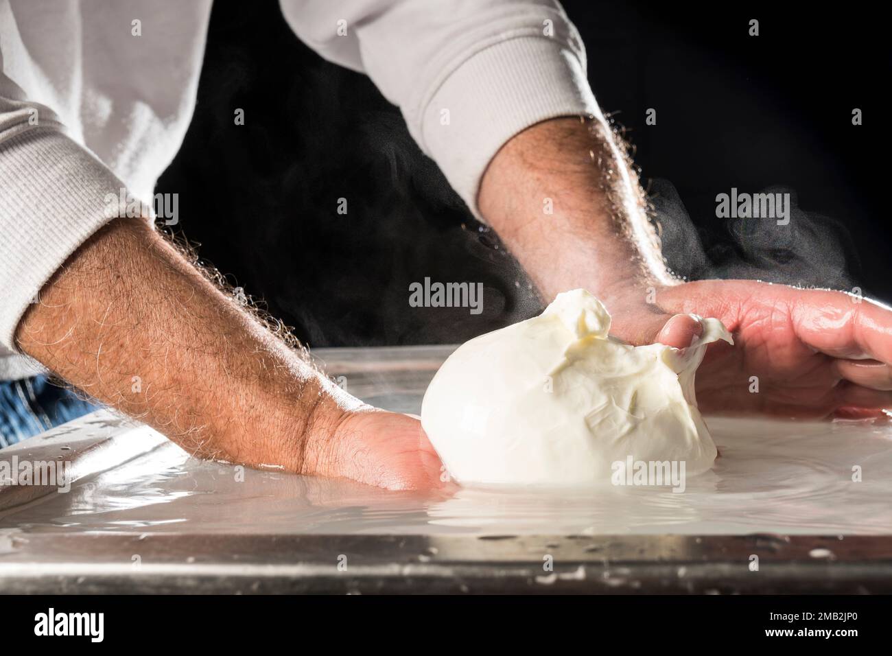 Making of mozzarella cheese hi-res stock photography and images - Alamy