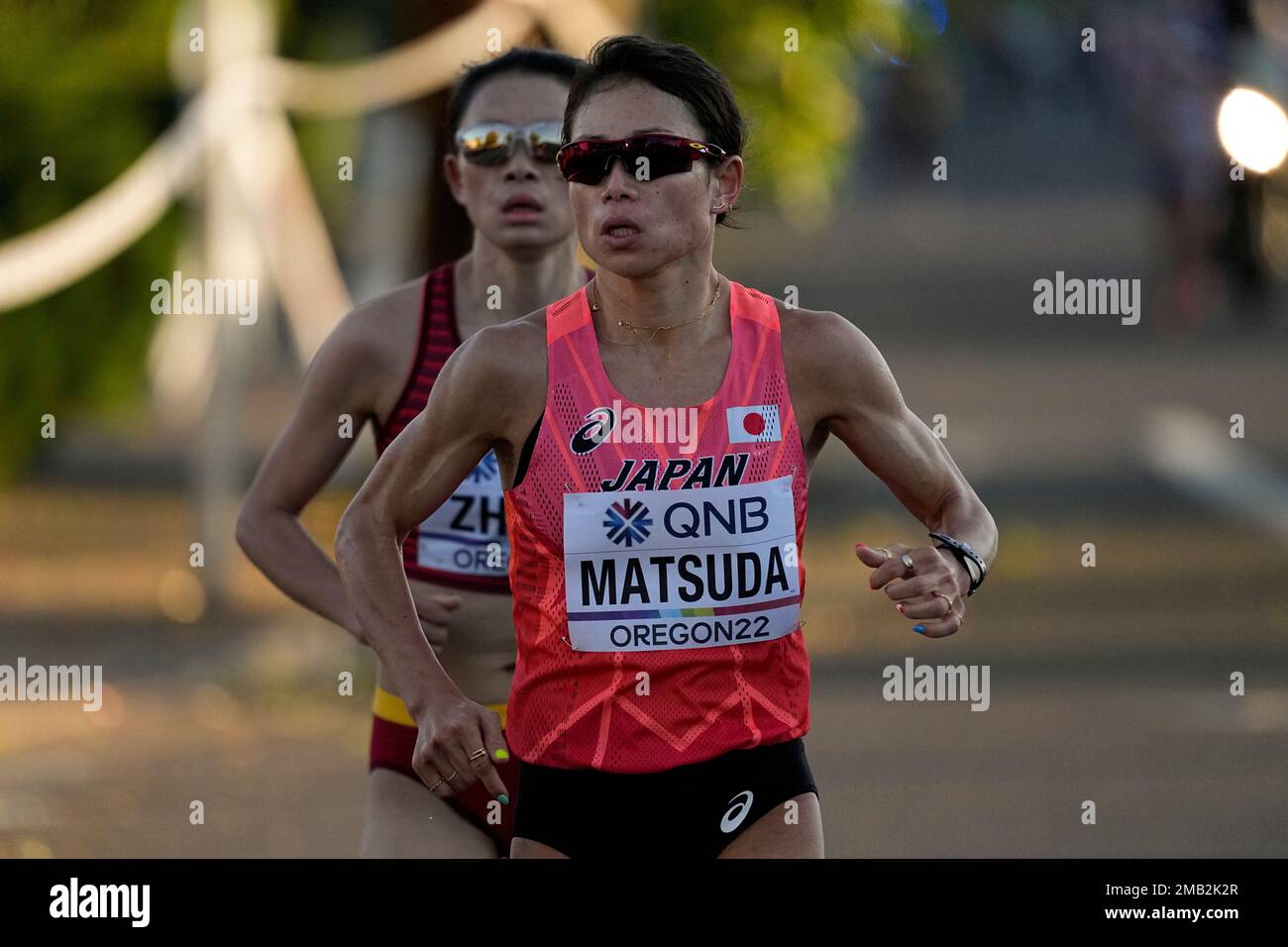 Deshun Zhang, of China, left, Mizuki Matsuda, of Japan, compete during ...