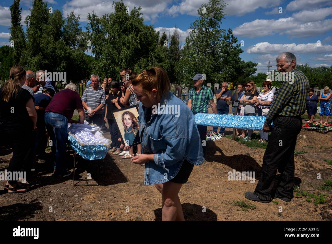 Relatives and friends of 35-year-old Anna Protsenko, who was killed in ...