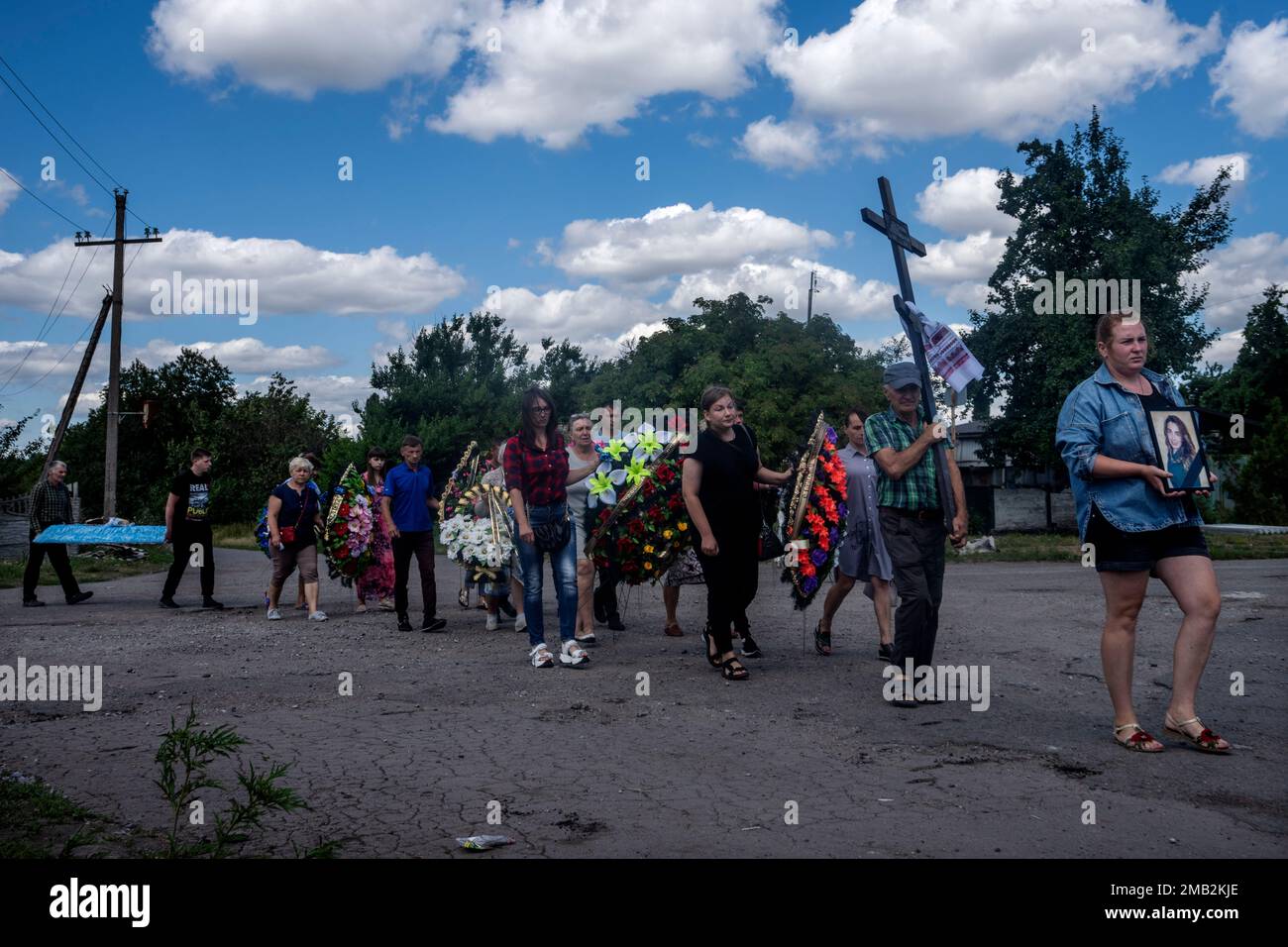 Relatives and friends of 35-year-old Anna Protsenko, who was killed in ...