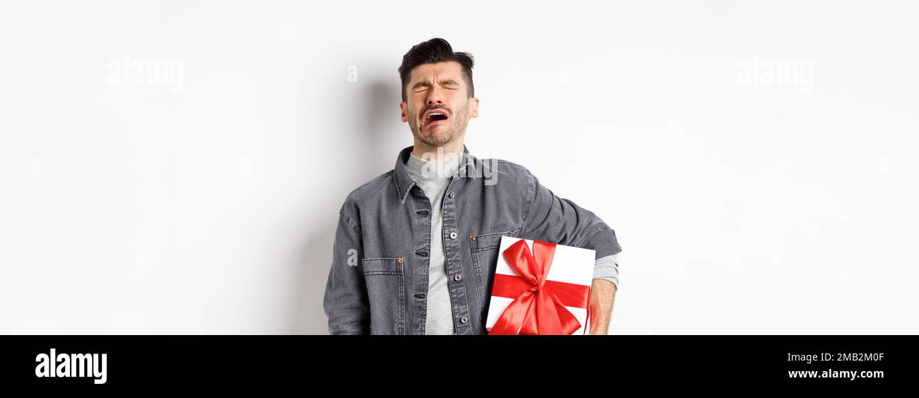 Valentines day heartbreak. Single and heartbroken guy crying lonely ...