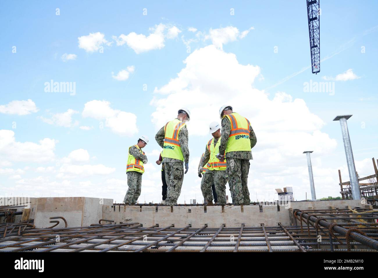 NAVFAC Washington leadership inspects the roof of Building 3 at Walter ...