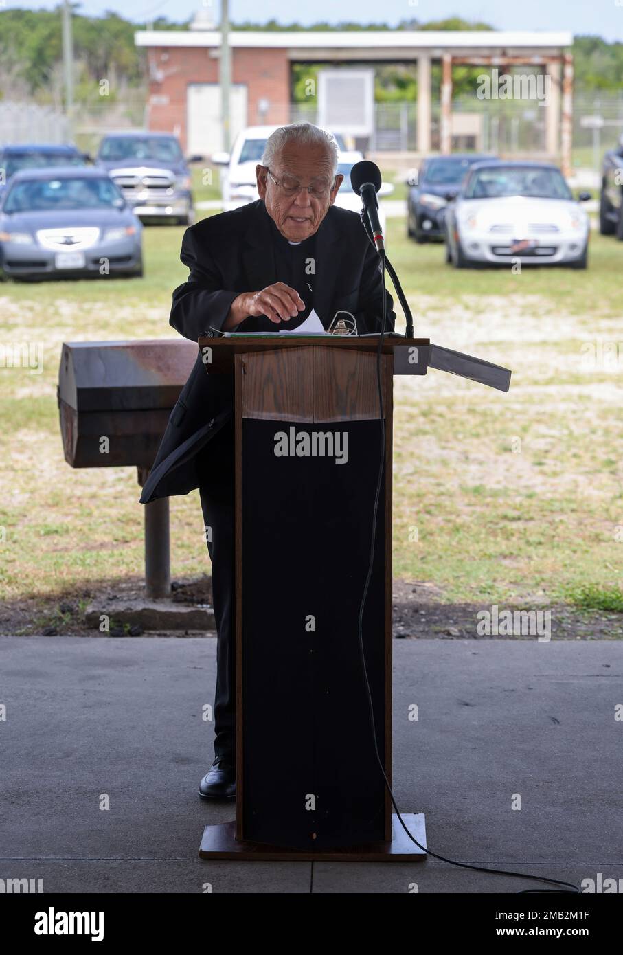 Reverend Monsignor Gerald Lewis, a retired U.S. Navy corpsman, gives a ...