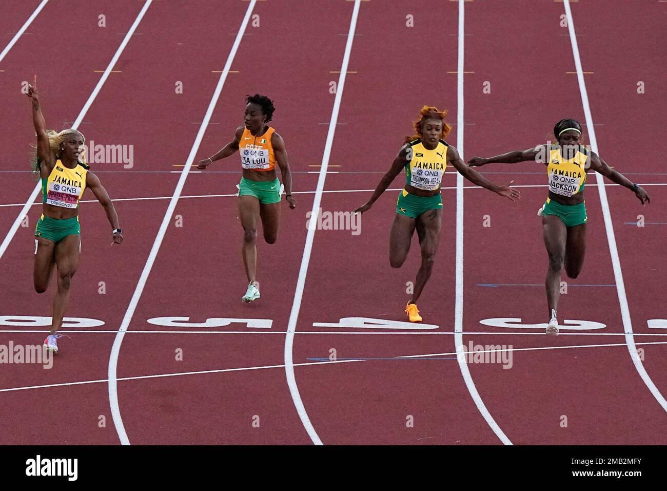 Shelly-Ann Fraser-Pryce, of Jamaica, wins the final in the women's 100-meter run as Elaine ...
