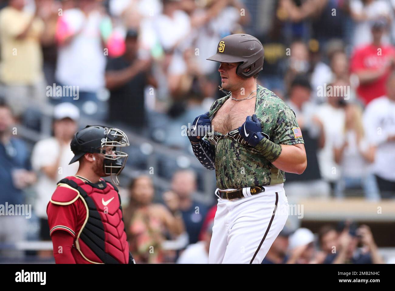 San Diego Padres' Luke Voit celebrates as he crossed the plate after ...