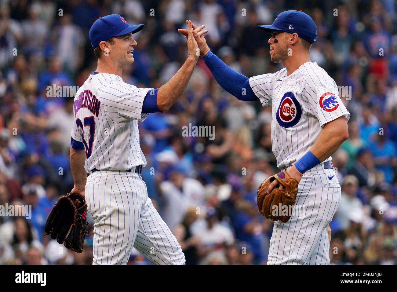 Chicago Cubs relief pitcher David Robertson, left, celebrates with Nico ...