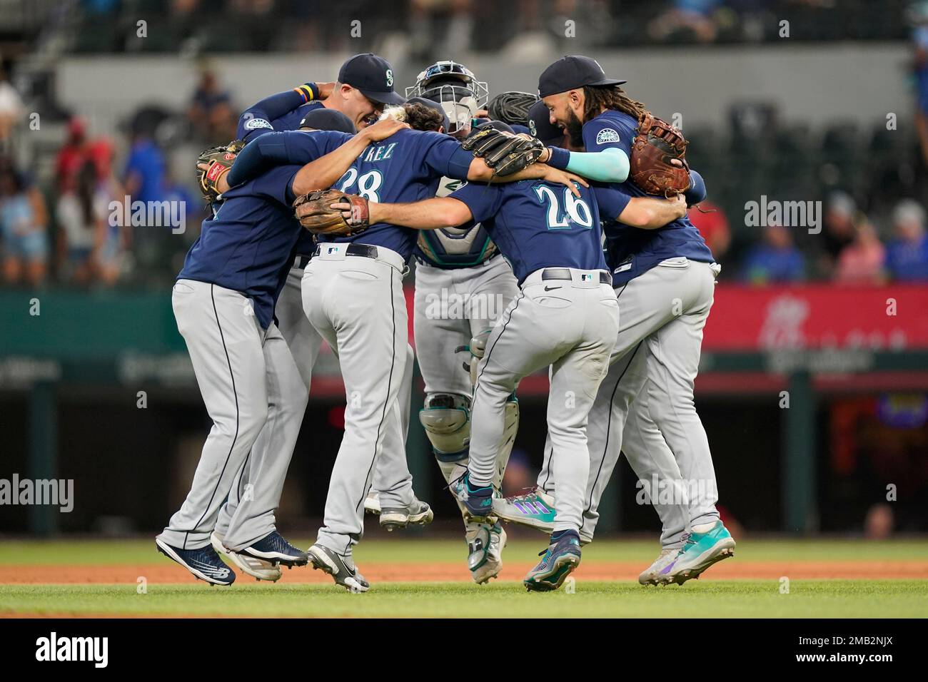 The Seattle Mariners dance in a circle after the final out of the ...