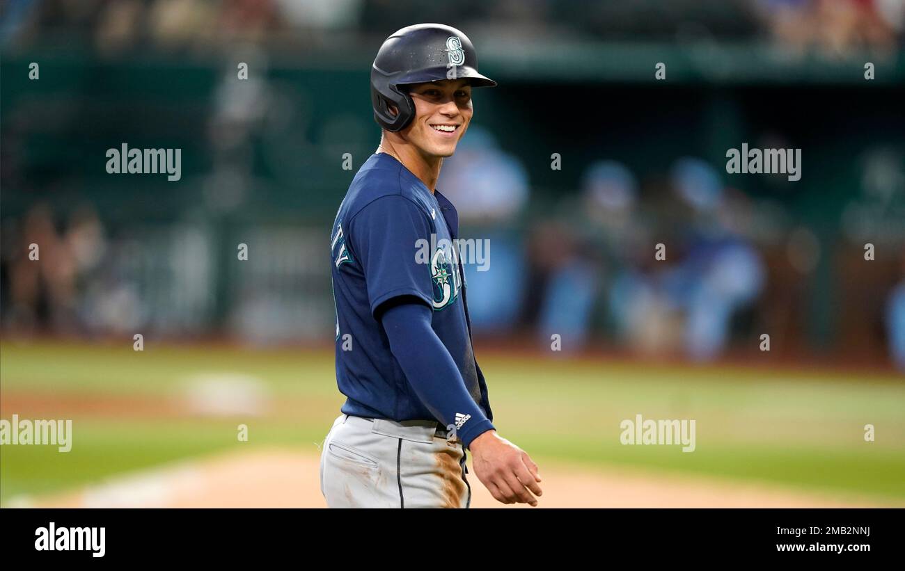 Seattle Mariners' Sam Haggerty smiles while on base during a baseball ...